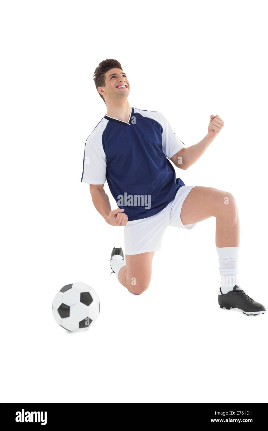 Athletic football player cheering Stock Photo - Alamy