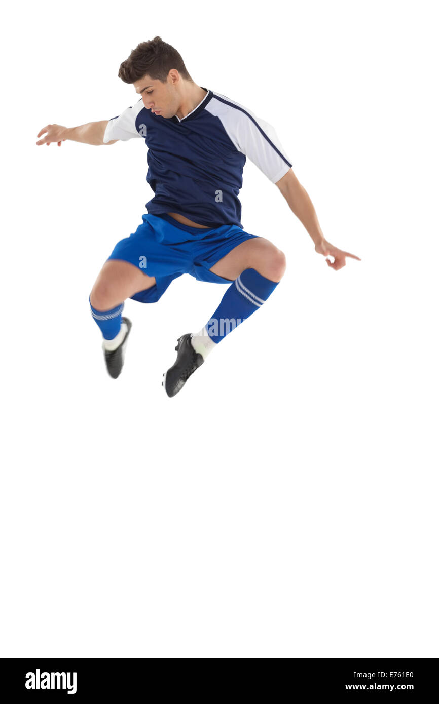 Full length of football player playing Stock Photo - Alamy