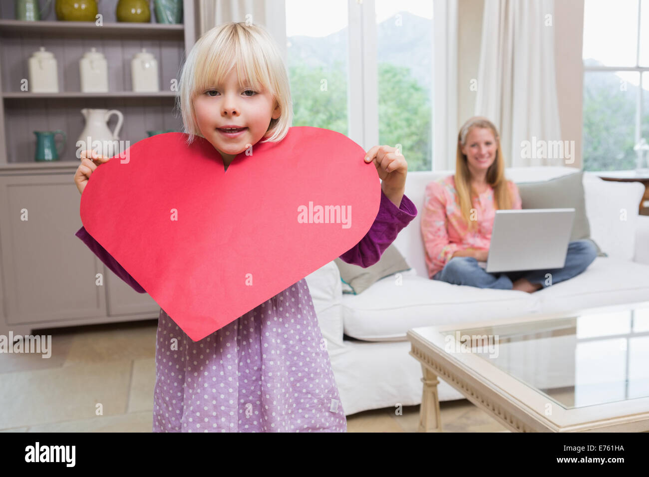 Little girl showing heart card Stock Photo - Alamy