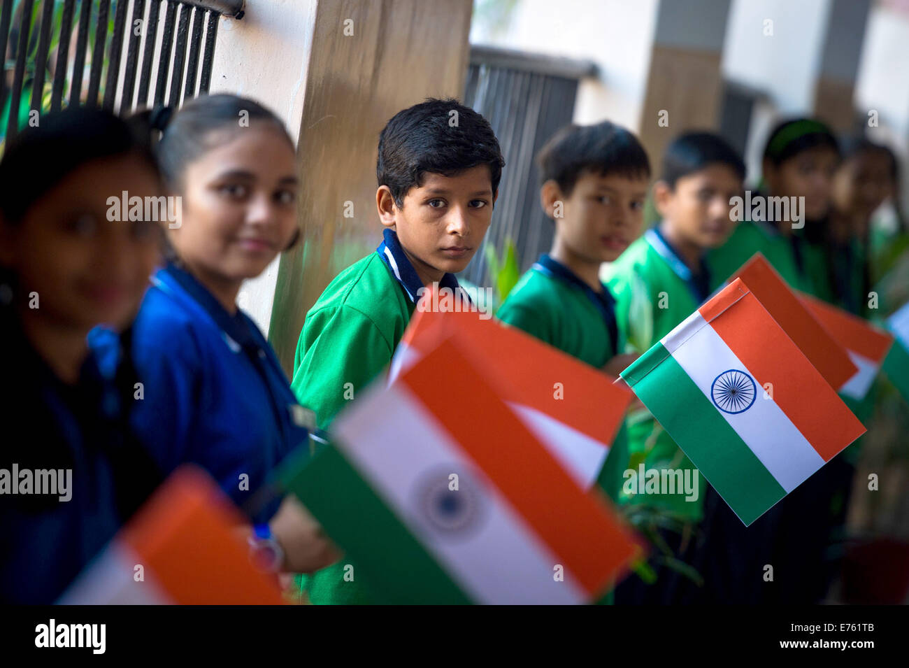 New Delhi, India. 08th Sep, 2014. Students wave Indian flags during a ...