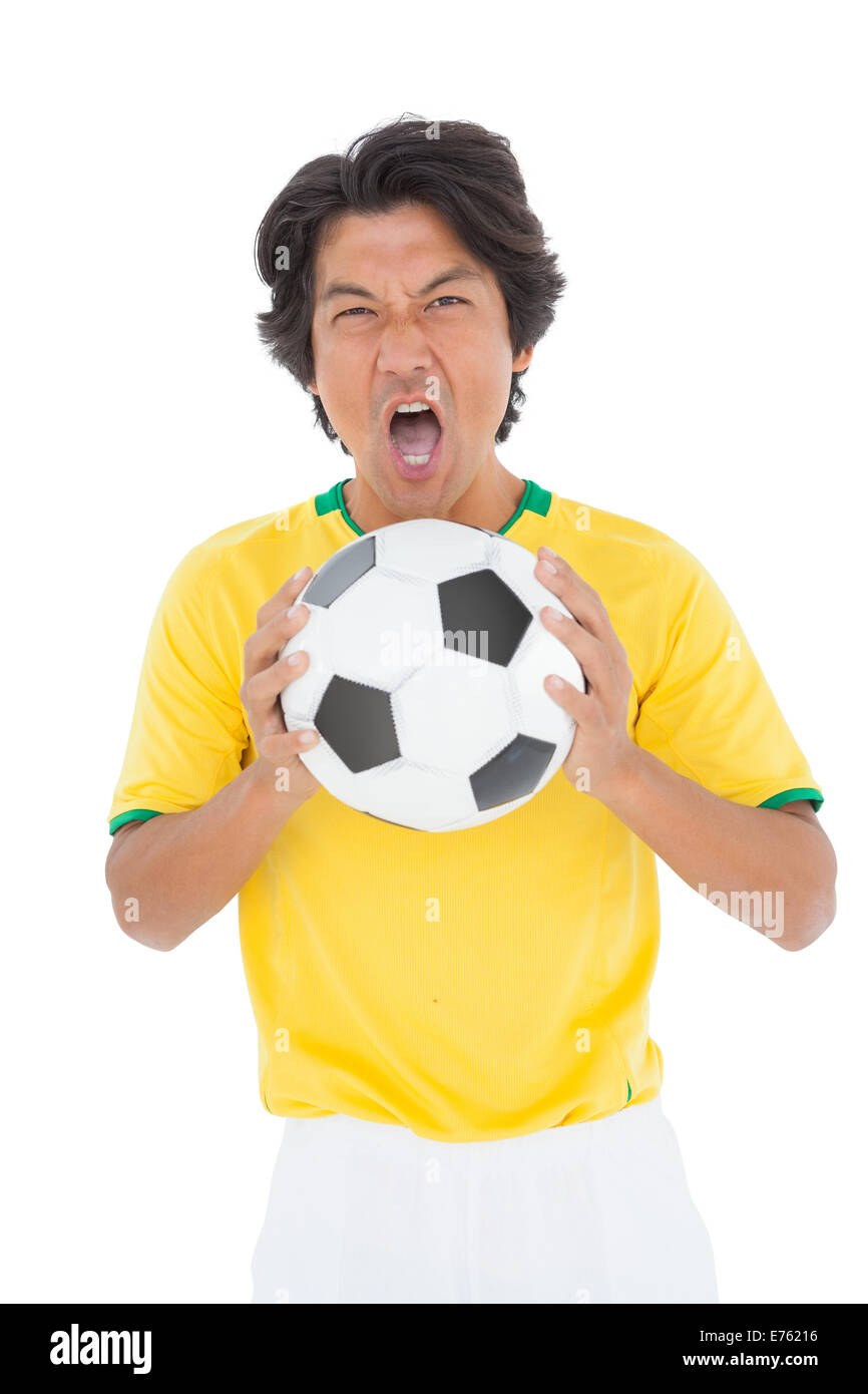 Portrait of a football player shouting Stock Photo - Alamy