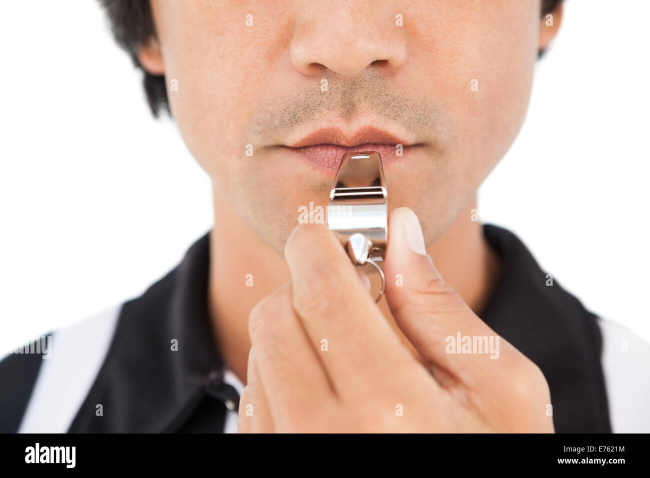 Close up mid section of referee blowing whistle Stock Photo - Alamy