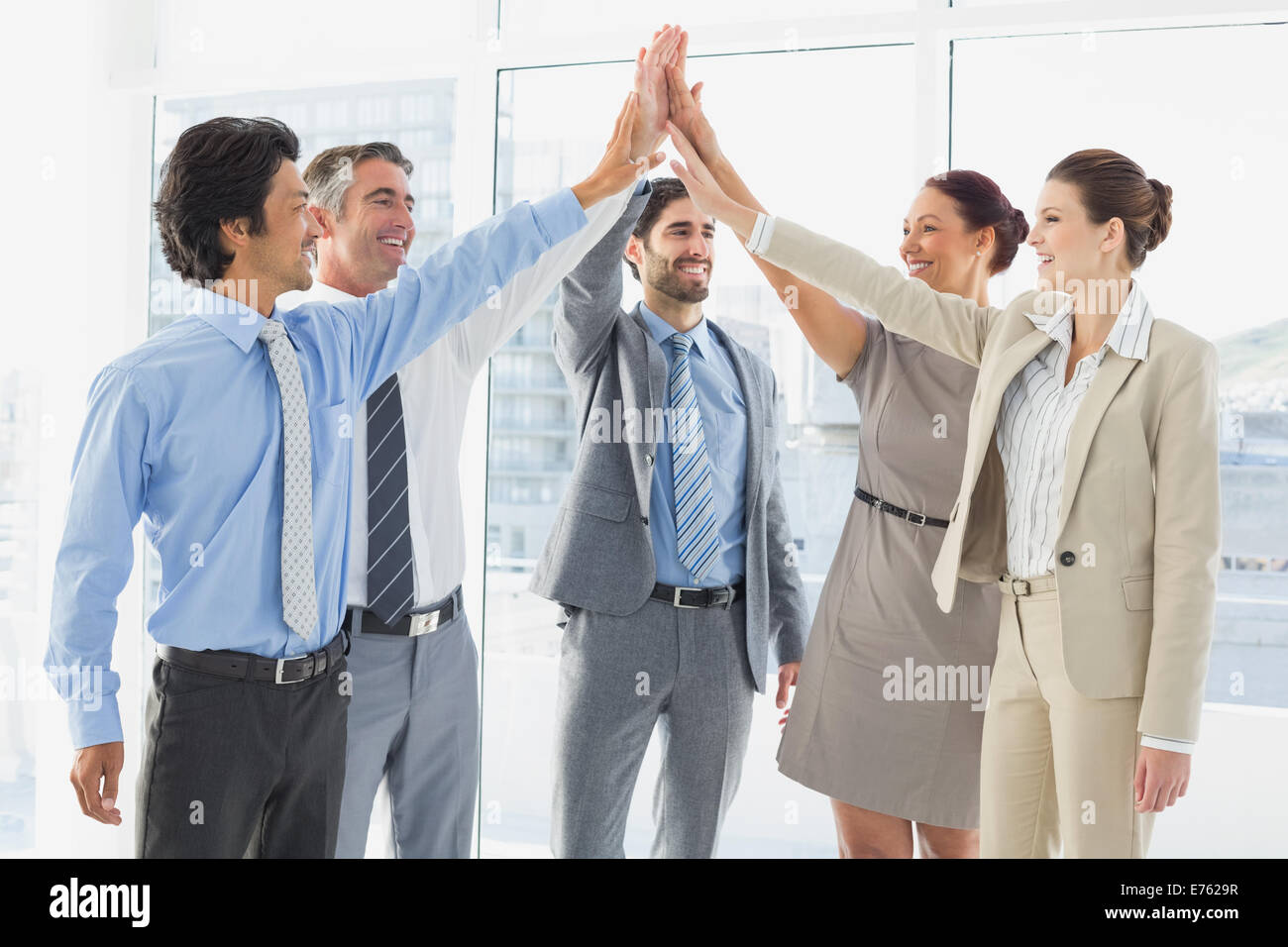 Employee's celebrating a good job Stock Photo - Alamy