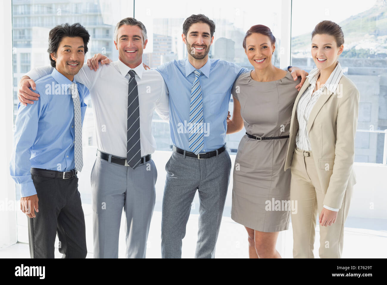 Employee's smiling for the camera Stock Photo - Alamy