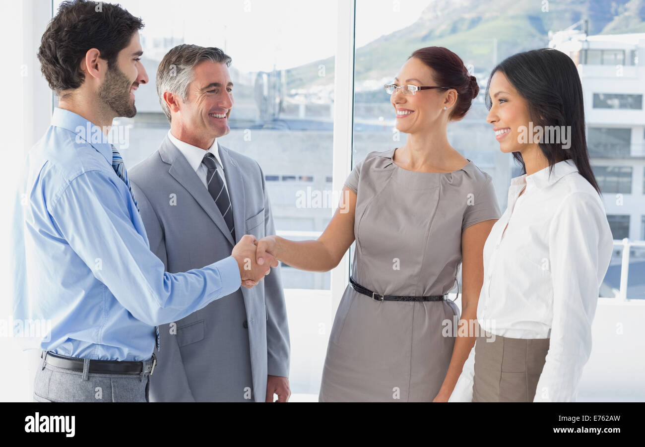 Happy two woman employees shaking hi-res stock photography and images ...