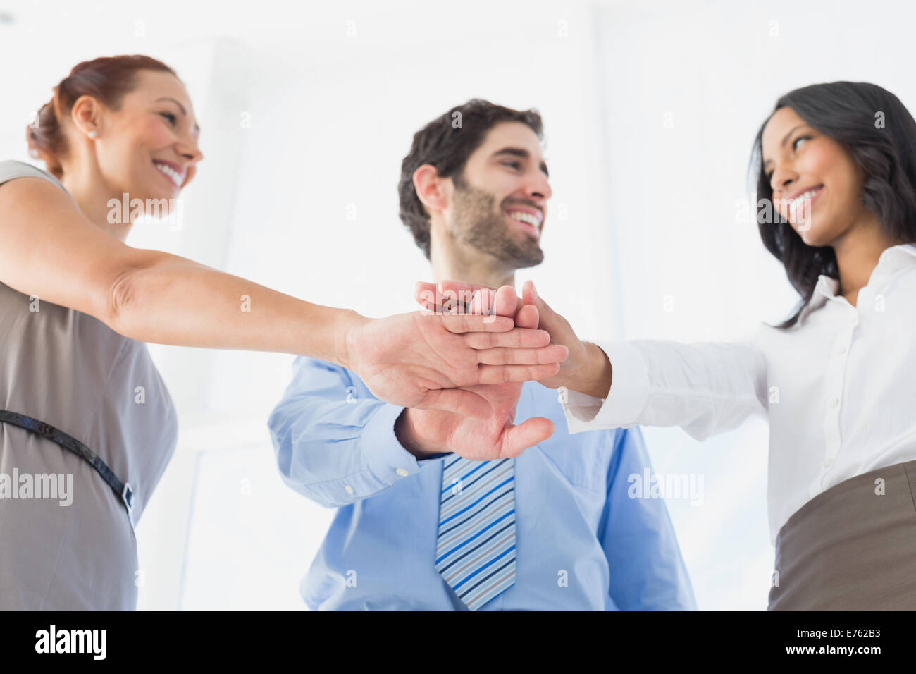 Stacked hands hi-res stock photography and images - Alamy