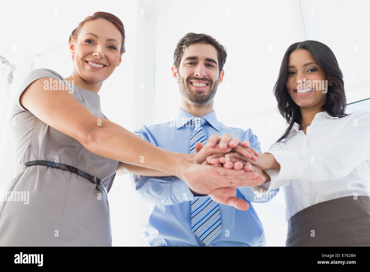 Stacked hands hi-res stock photography and images - Alamy
