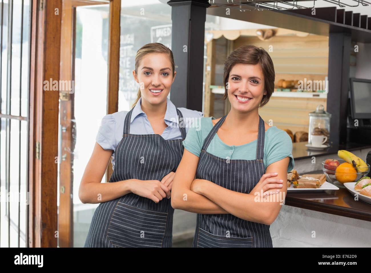 Pretty waitresses smiling at camera Stock Photo - Alamy