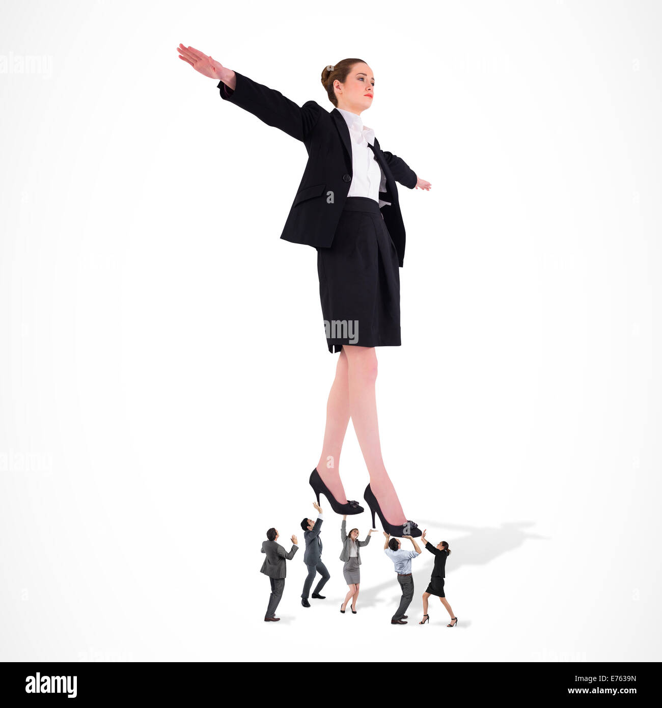 Composite image of business team supporting boss Stock Photo - Alamy