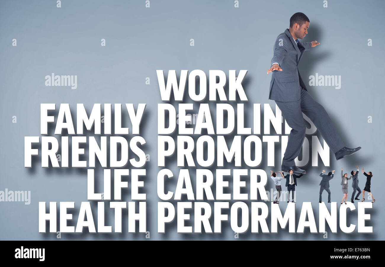 Composite image of business people supporting boss Stock Photo - Alamy