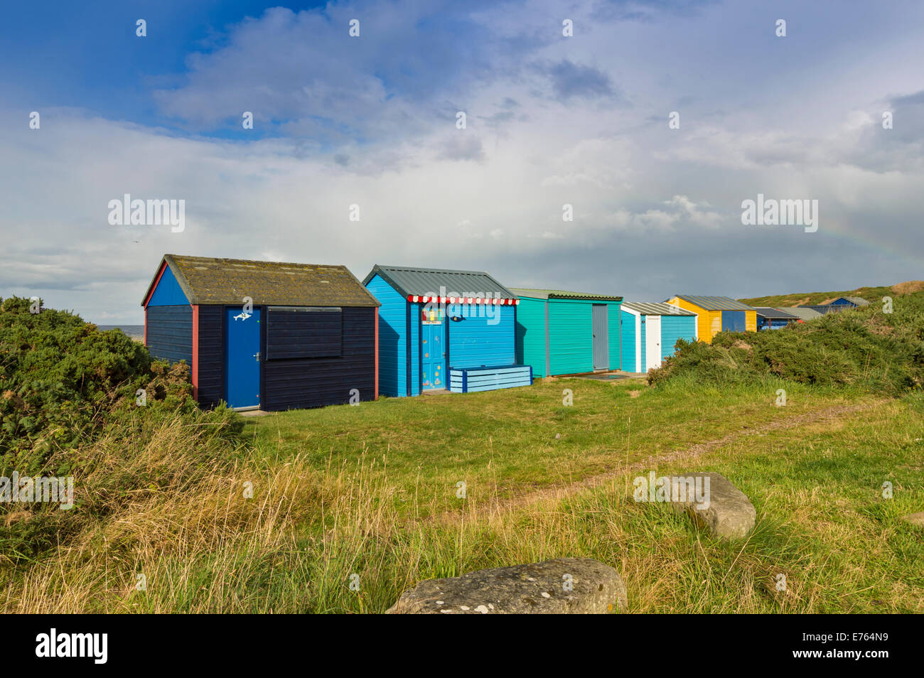CHALETS AT HOPEMAN BEACH MORAY BLUE SKY AND SMALL RAINBOW OVER ROWS OF ...