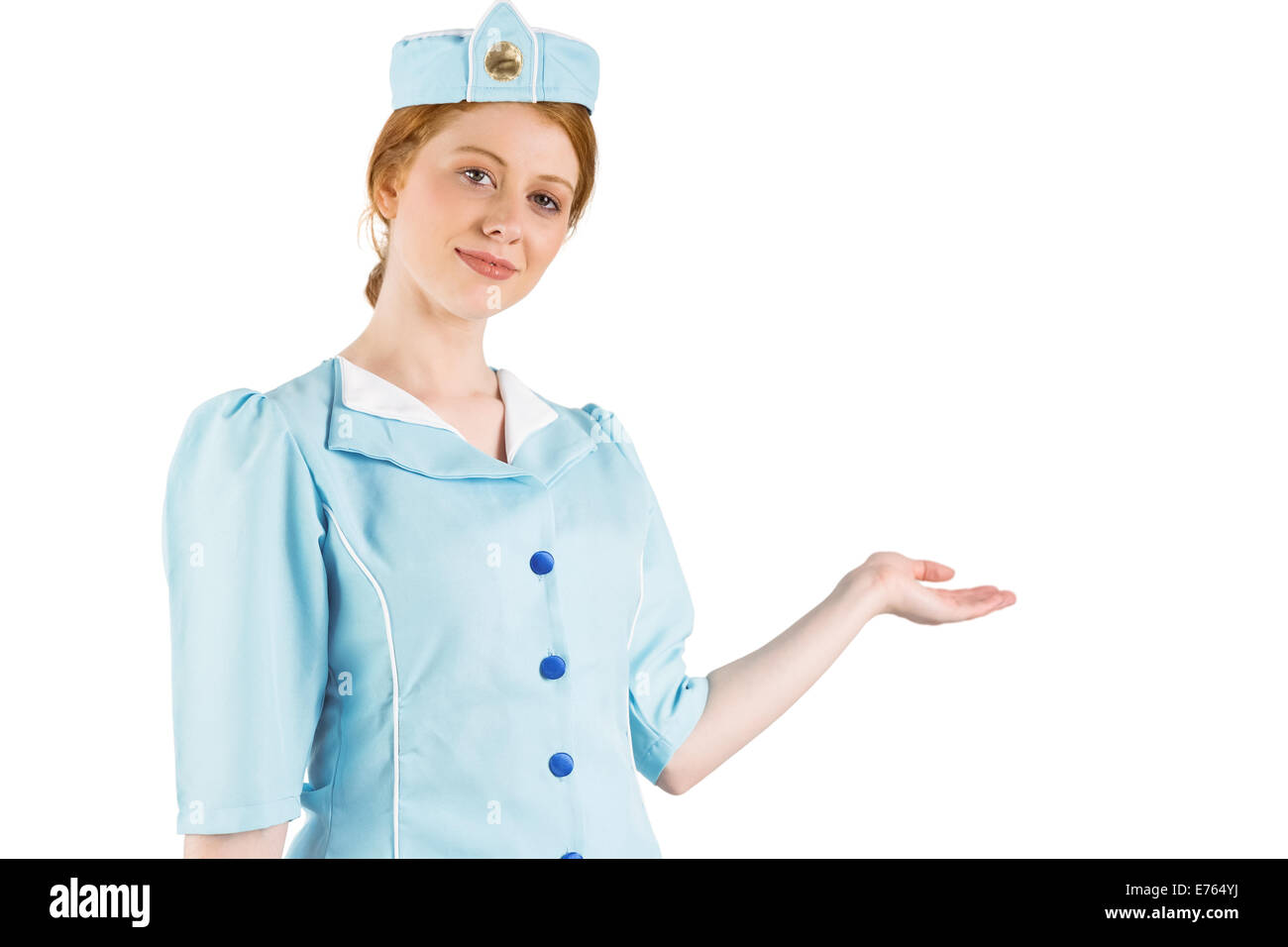 Pretty air hostess presenting with hand Stock Photo - Alamy