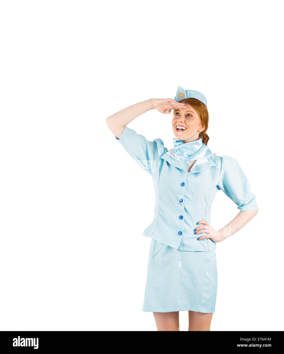 Pretty air hostess looking up Stock Photo - Alamy