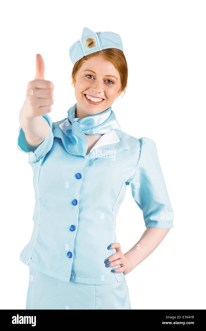 Pretty air hostess with hand on hip Stock Photo - Alamy