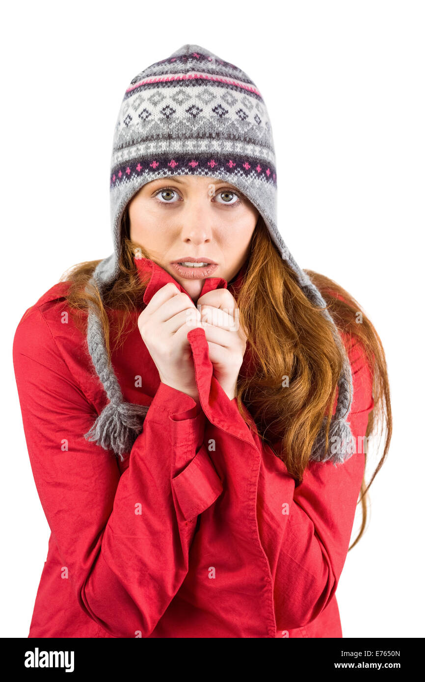 Cold redhead wearing coat and hat Stock Photo - Alamy