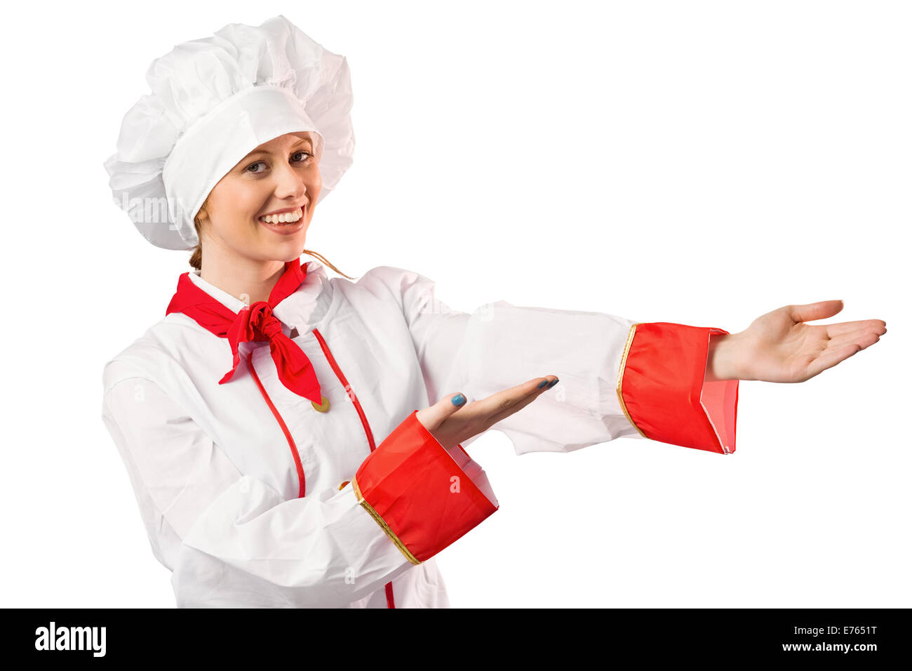 Pretty chef presenting with hands Stock Photo - Alamy