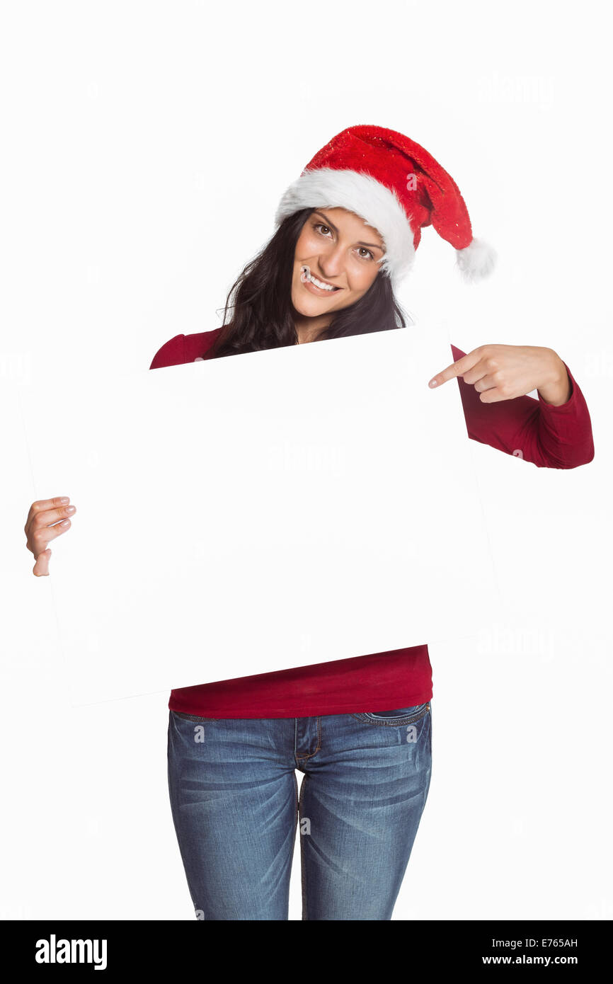 Woman pointing at white sign Stock Photo - Alamy