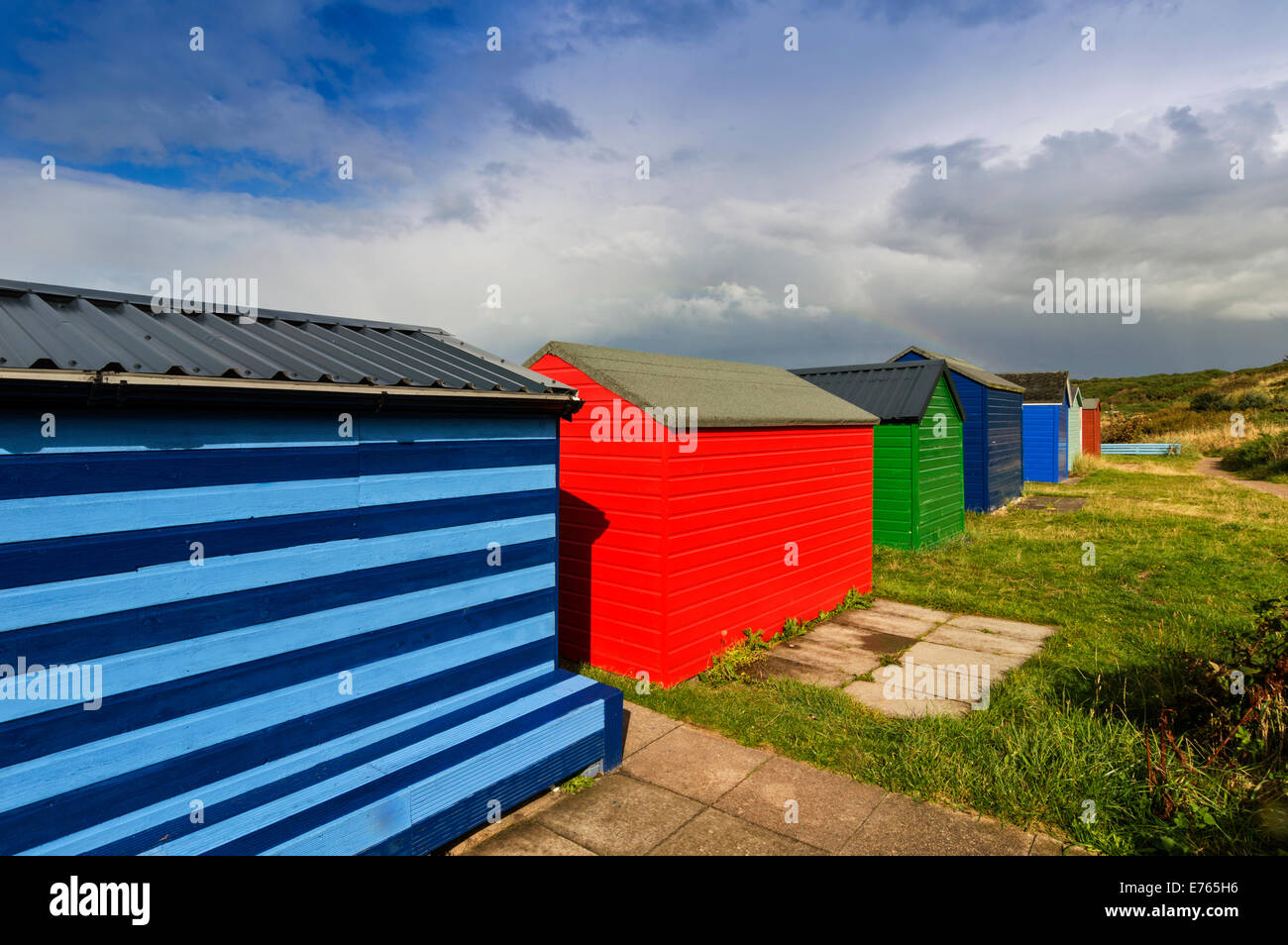 CHALETS AT HOPEMAN BEACH MORAY BLUE SKY AND STORM CLOUDS OVER ROWS OF ...