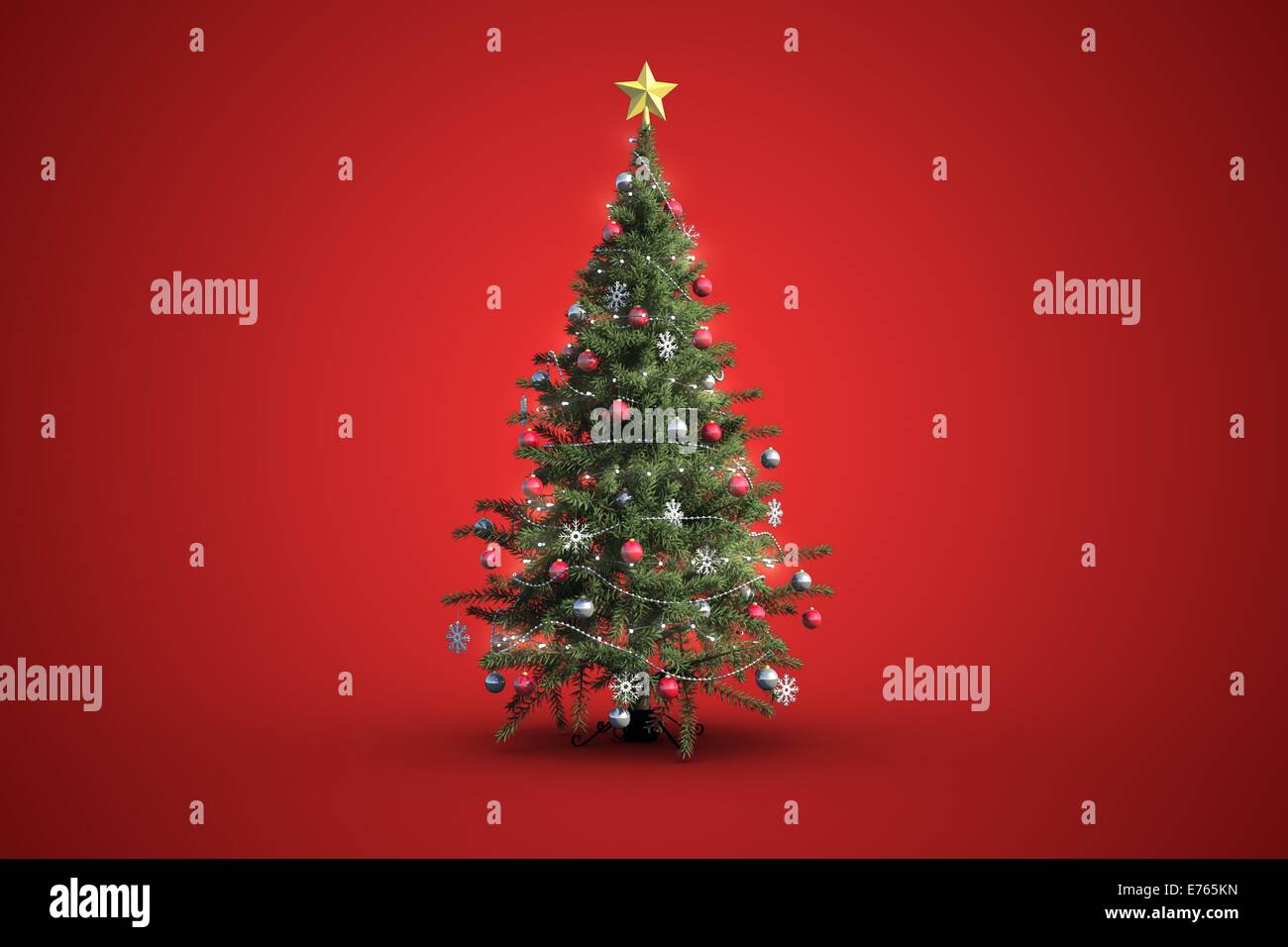 Christmas tree on red background Stock Photo - Alamy