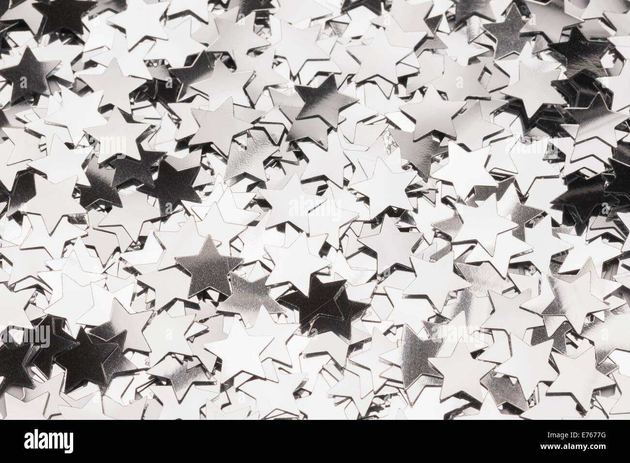 Many silver star decorations background Stock Photo - Alamy