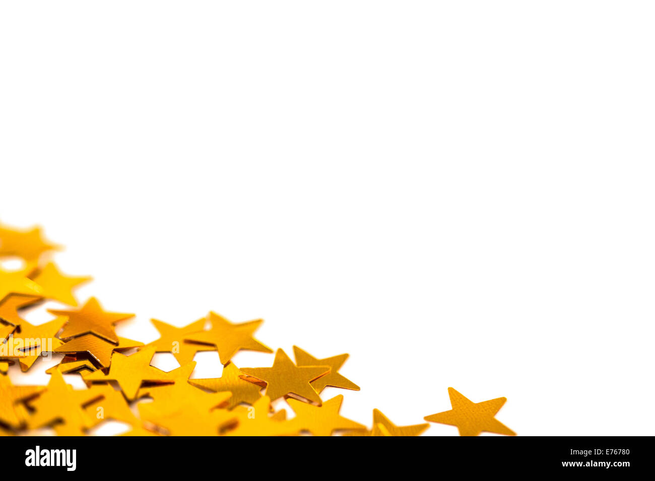 Golden star decorations spread out Stock Photo - Alamy
