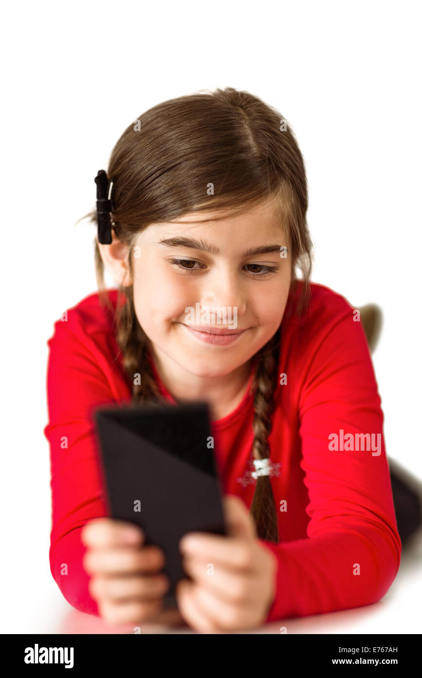 Cute little girl using smartphone Stock Photo - Alamy