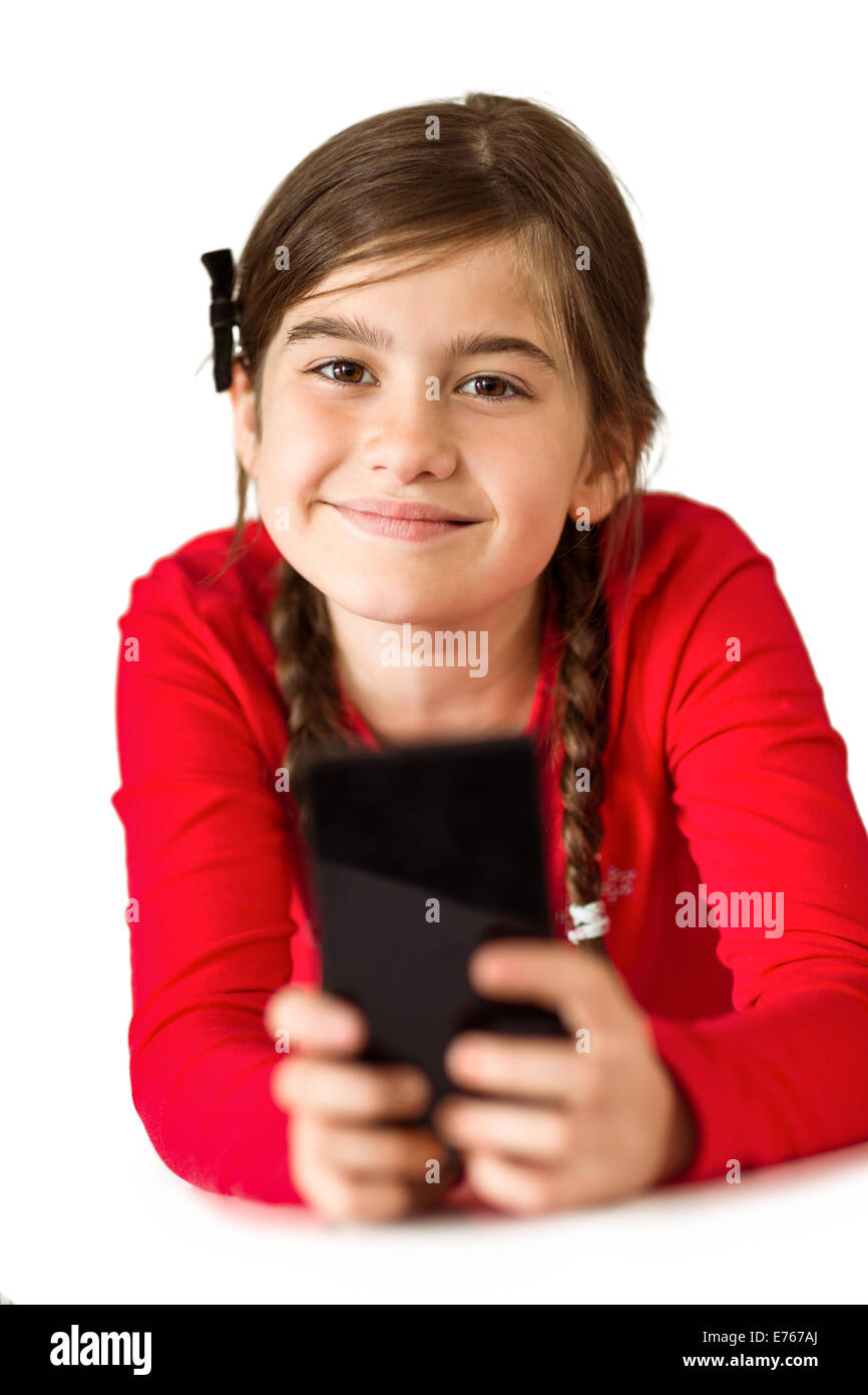 Cute little girl using smartphone Stock Photo - Alamy