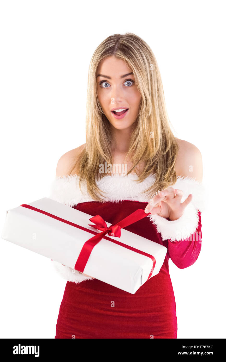 Pretty santa girl opening gift Stock Photo - Alamy