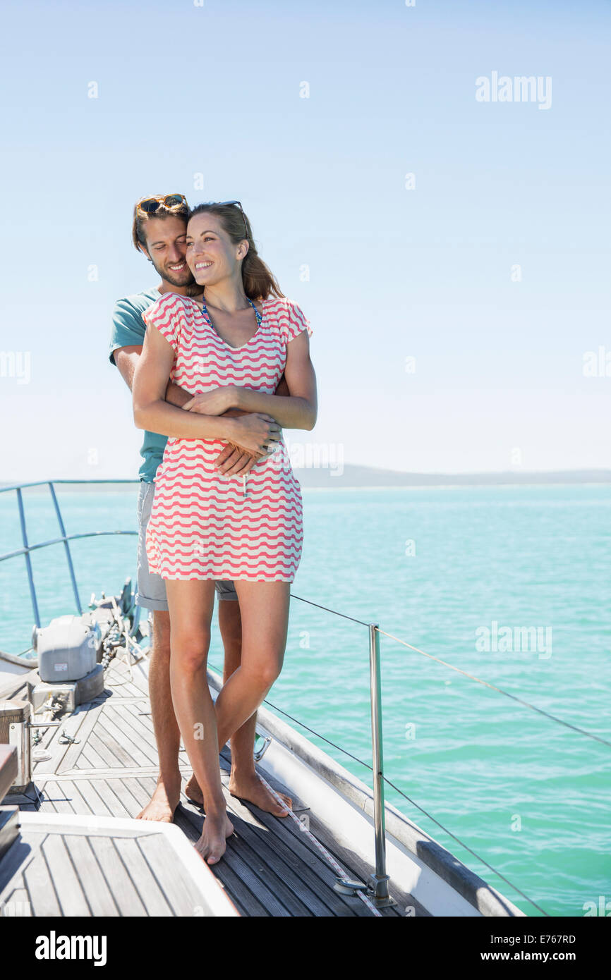 Couple standing on boat together Stock Photo - Alamy