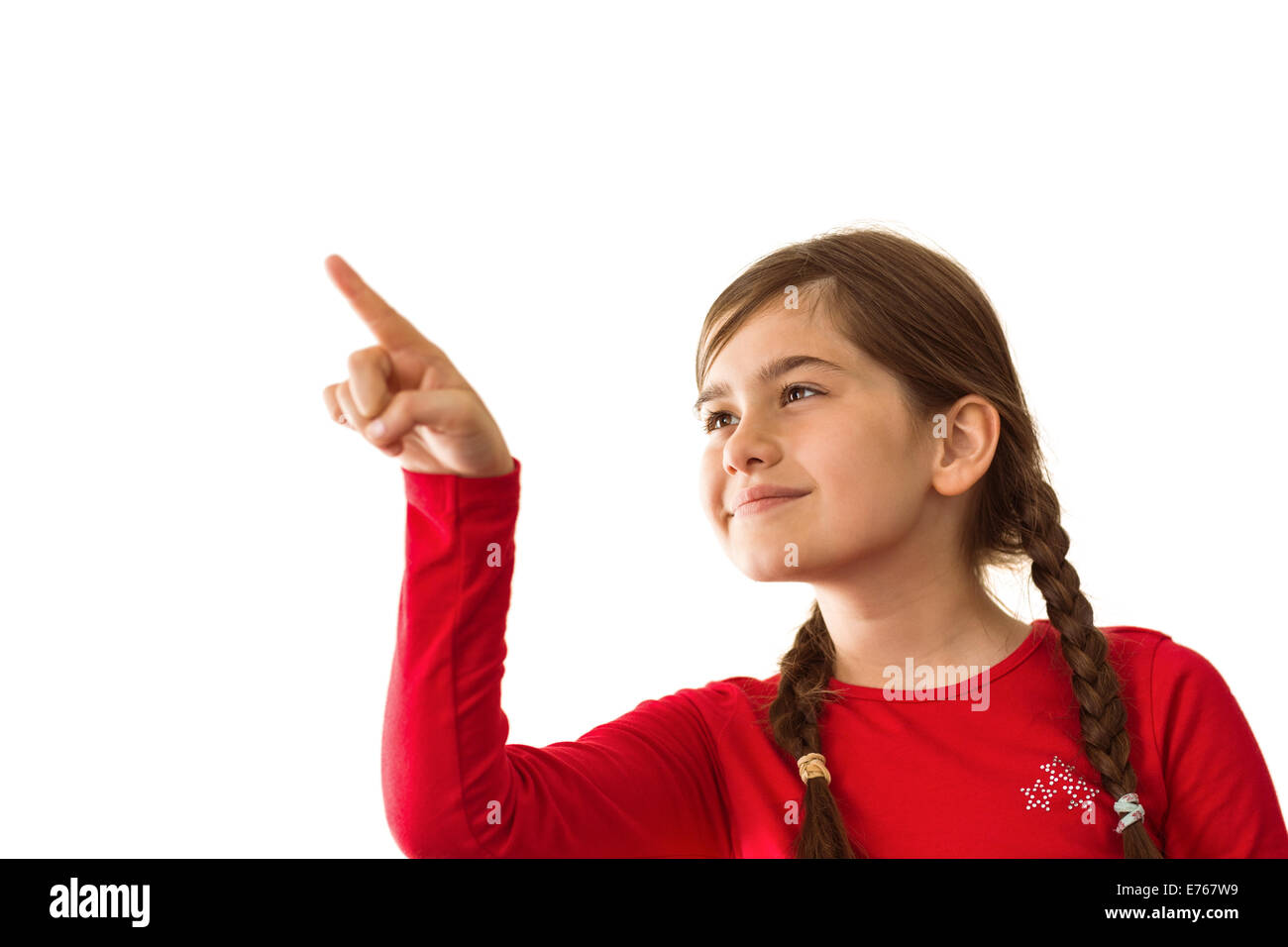 Cute little girl smiling and pointing Stock Photo - Alamy