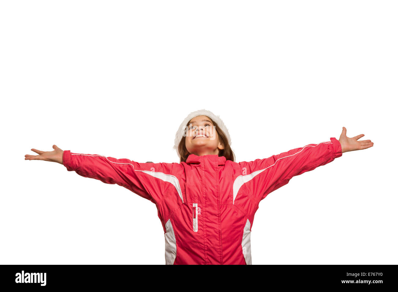 Cute girl in winter clothes with arms out Stock Photo - Alamy