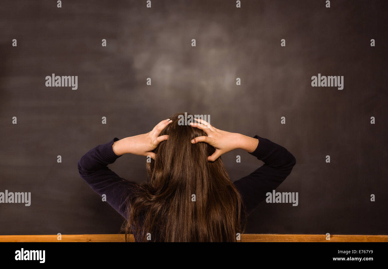 Confused pupil looking at chalkboard Stock Photo - Alamy