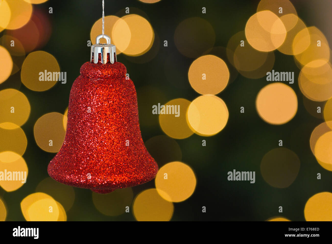 Red christmas bell decoration hanging Stock Photo - Alamy