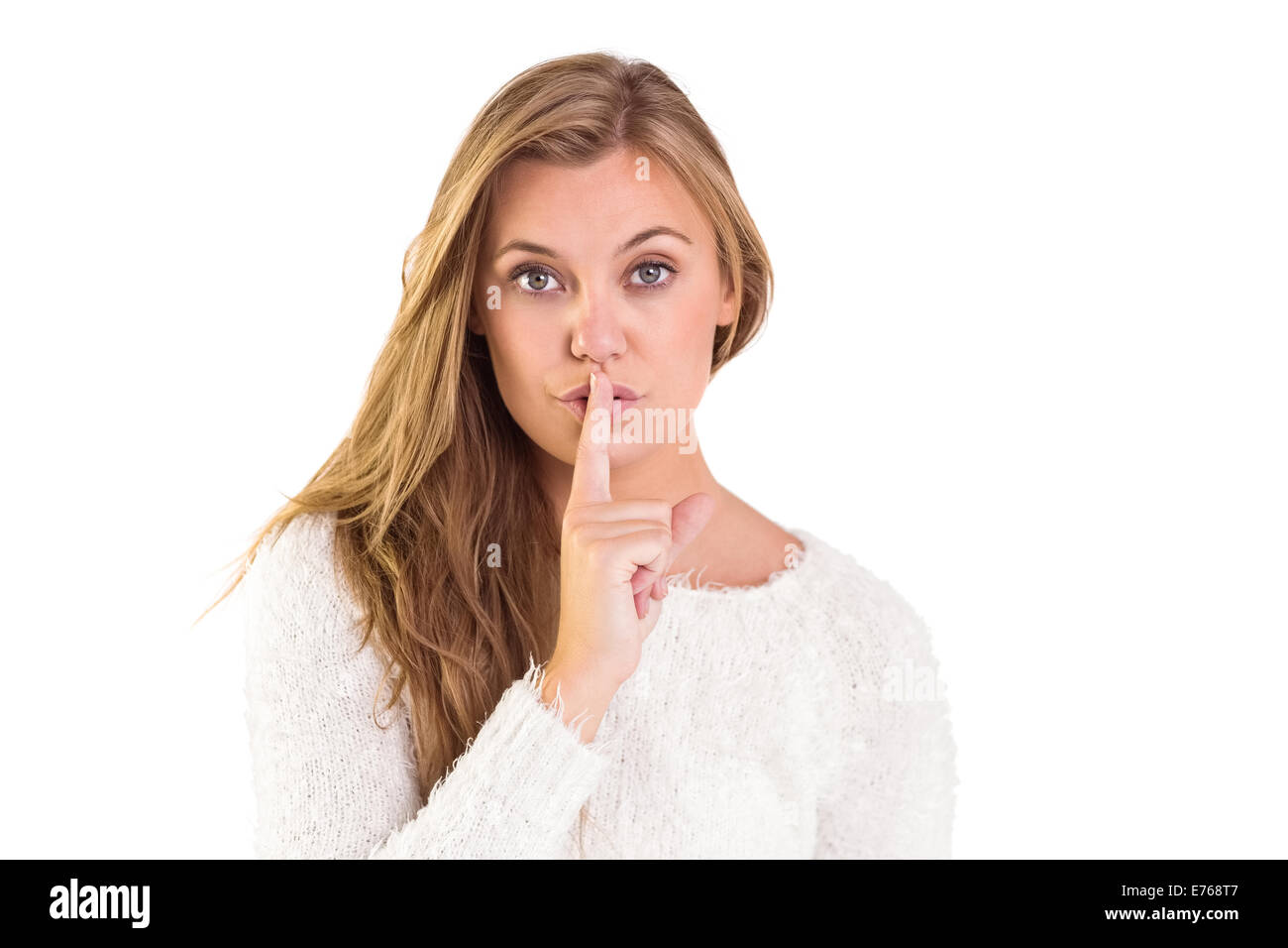 Pretty blonde keeping a secret Stock Photo - Alamy