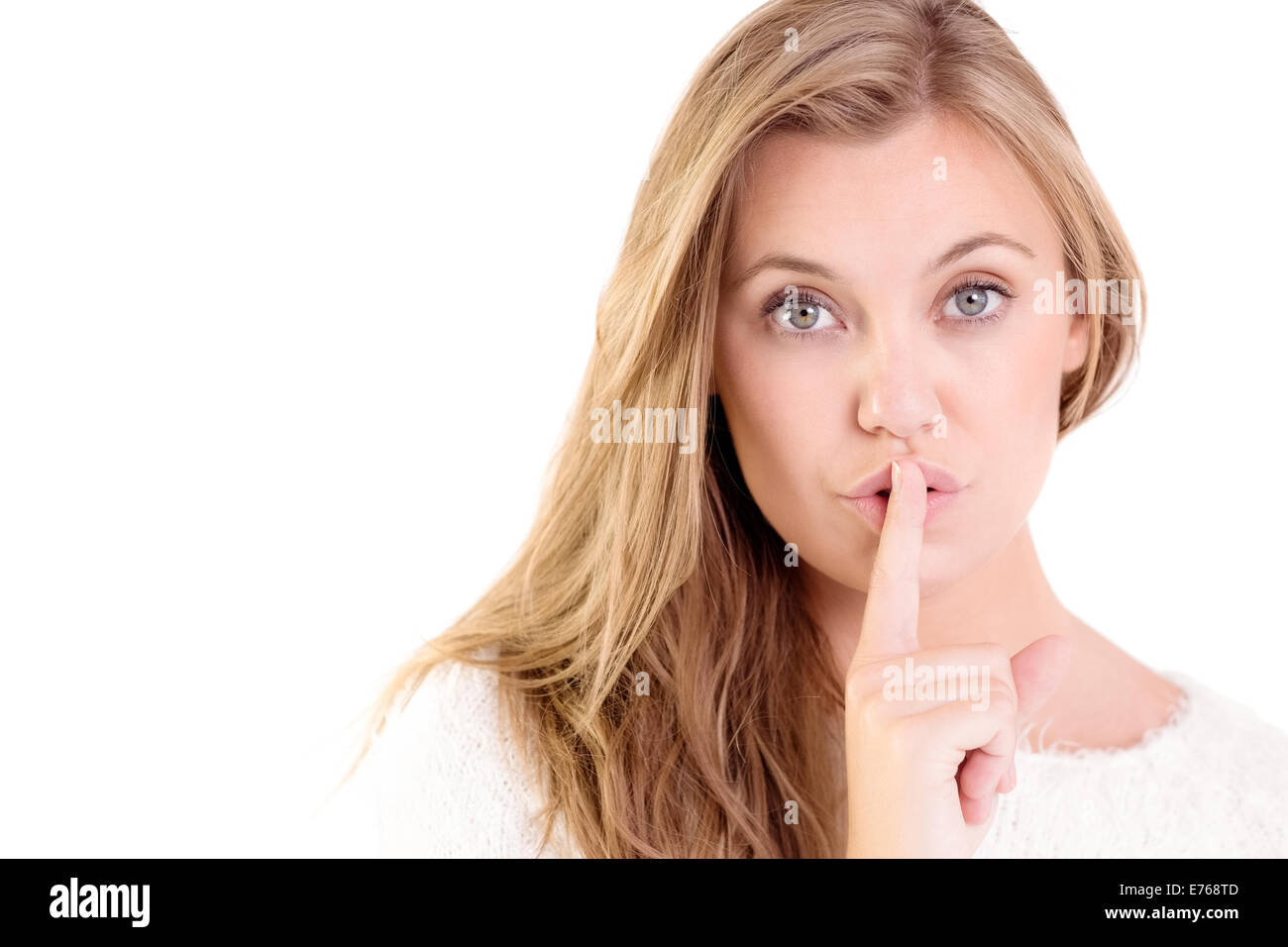 Pretty blonde keeping a secret Stock Photo - Alamy