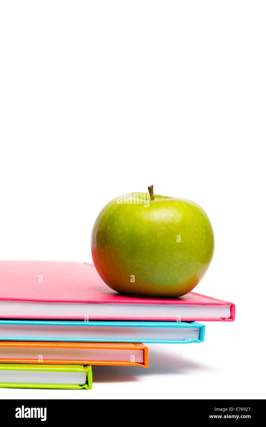 Green apple on notebooks Stock Photo - Alamy