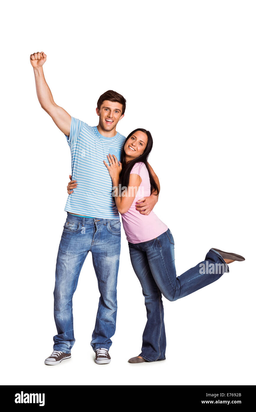 Young couple cheering at camera Stock Photo - Alamy
