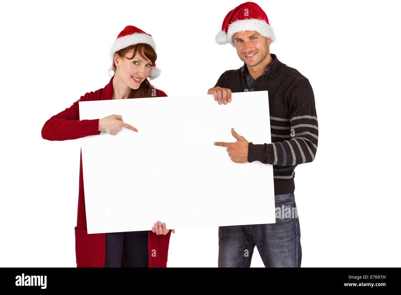 Couple holding a white sign Stock Photo - Alamy