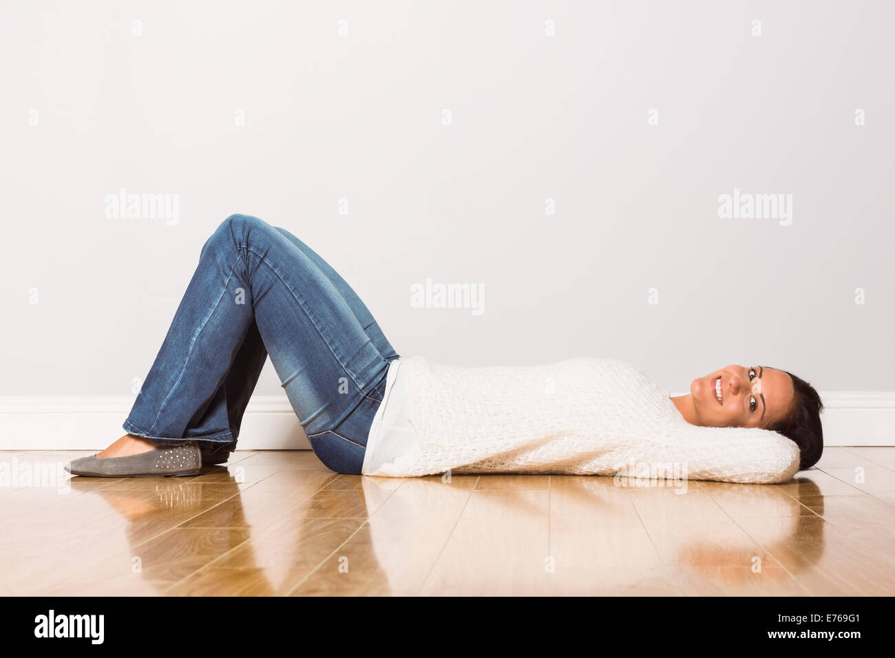 Woman Lying On Floor High Resolution Stock Photography and Images - Alamy