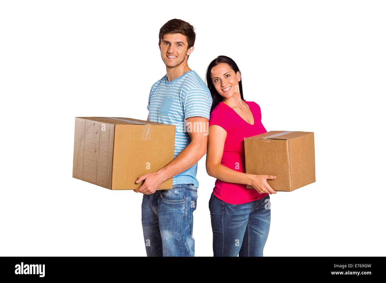 Young couple holding moving boxes Stock Photo - Alamy