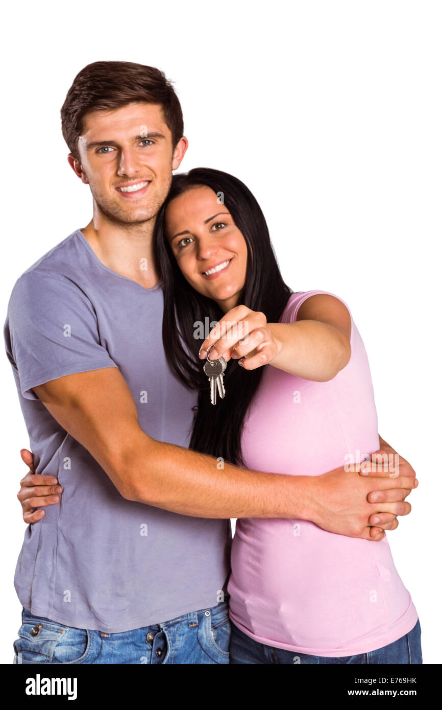 Young couple showing keys to house Stock Photo - Alamy