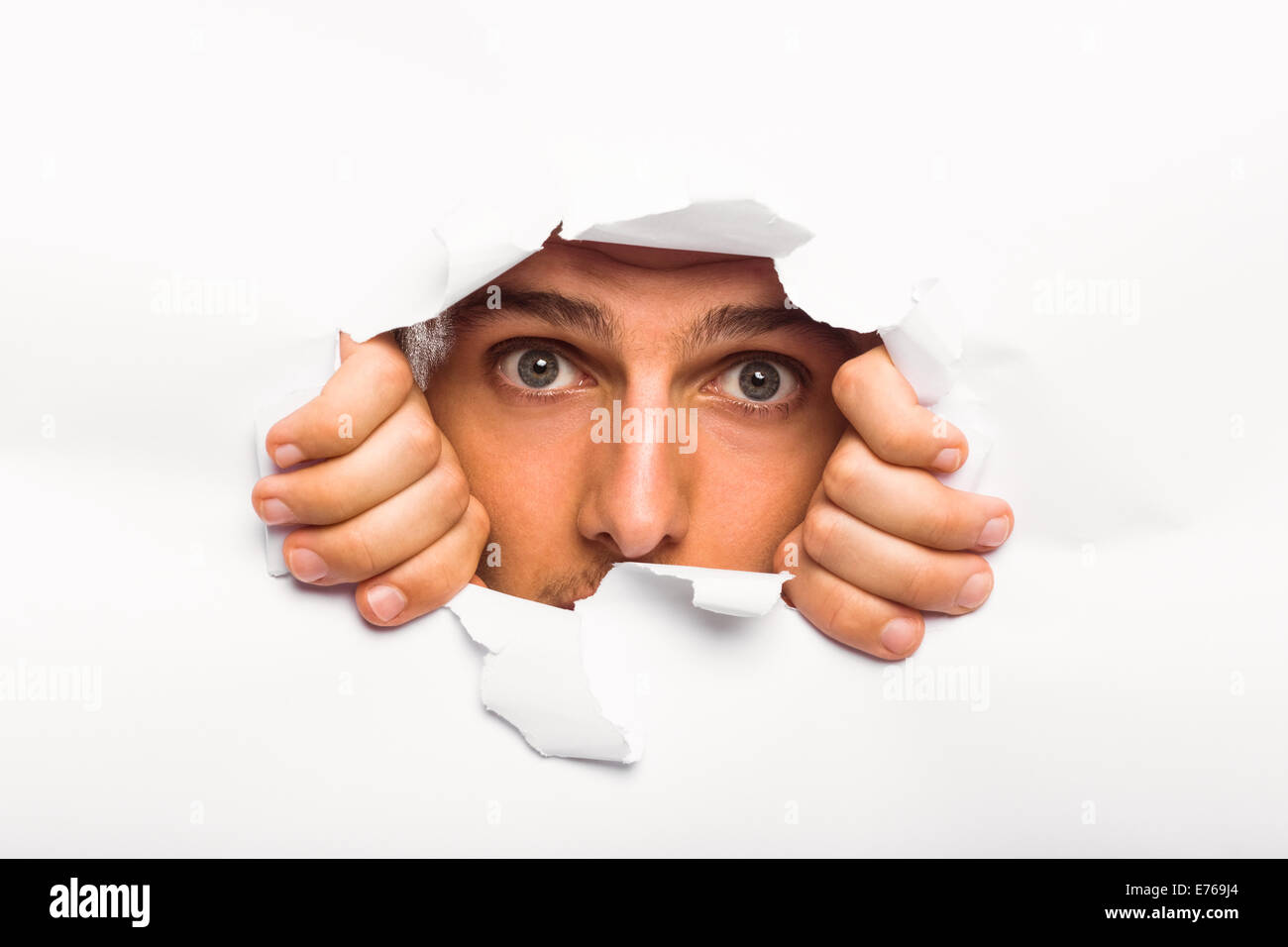 Tear paper eyes hi-res stock photography and images - Alamy