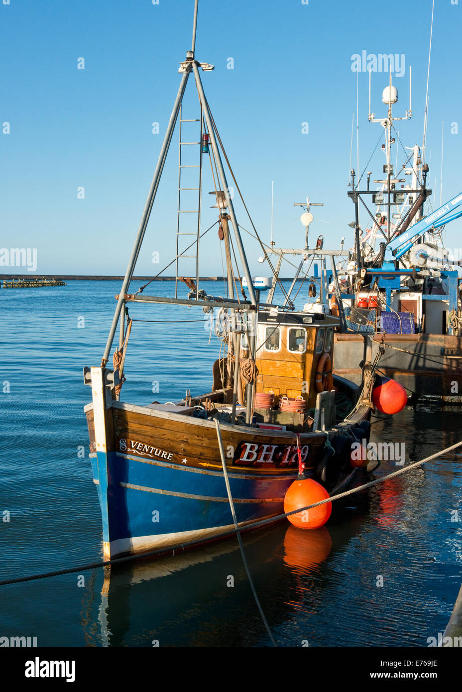 Small inshore fishing boat moored in Amble, Northumberland, England, UK ...