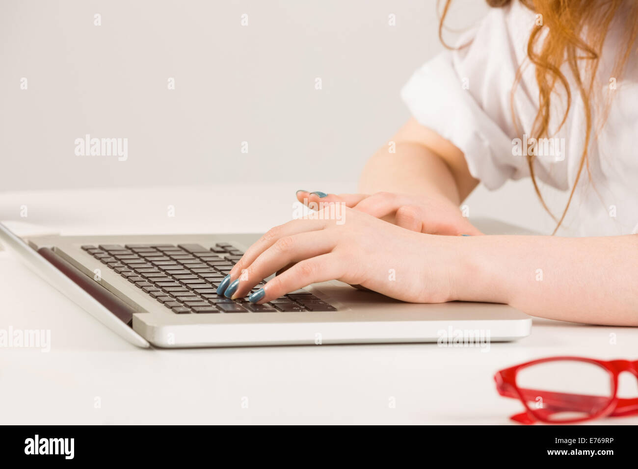 Female hands typing on laptop Stock Photo - Alamy