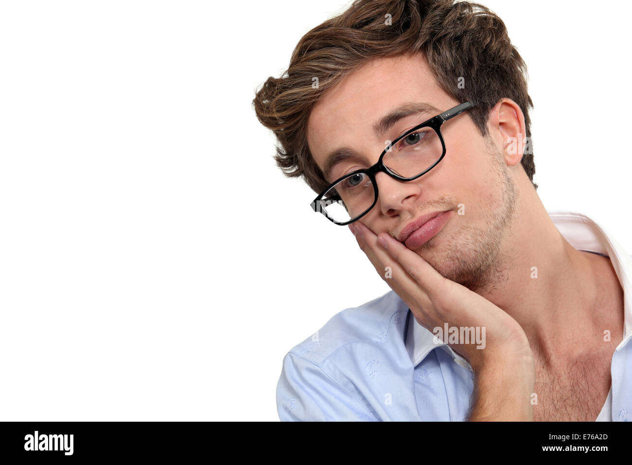 A bored young man Stock Photo - Alamy