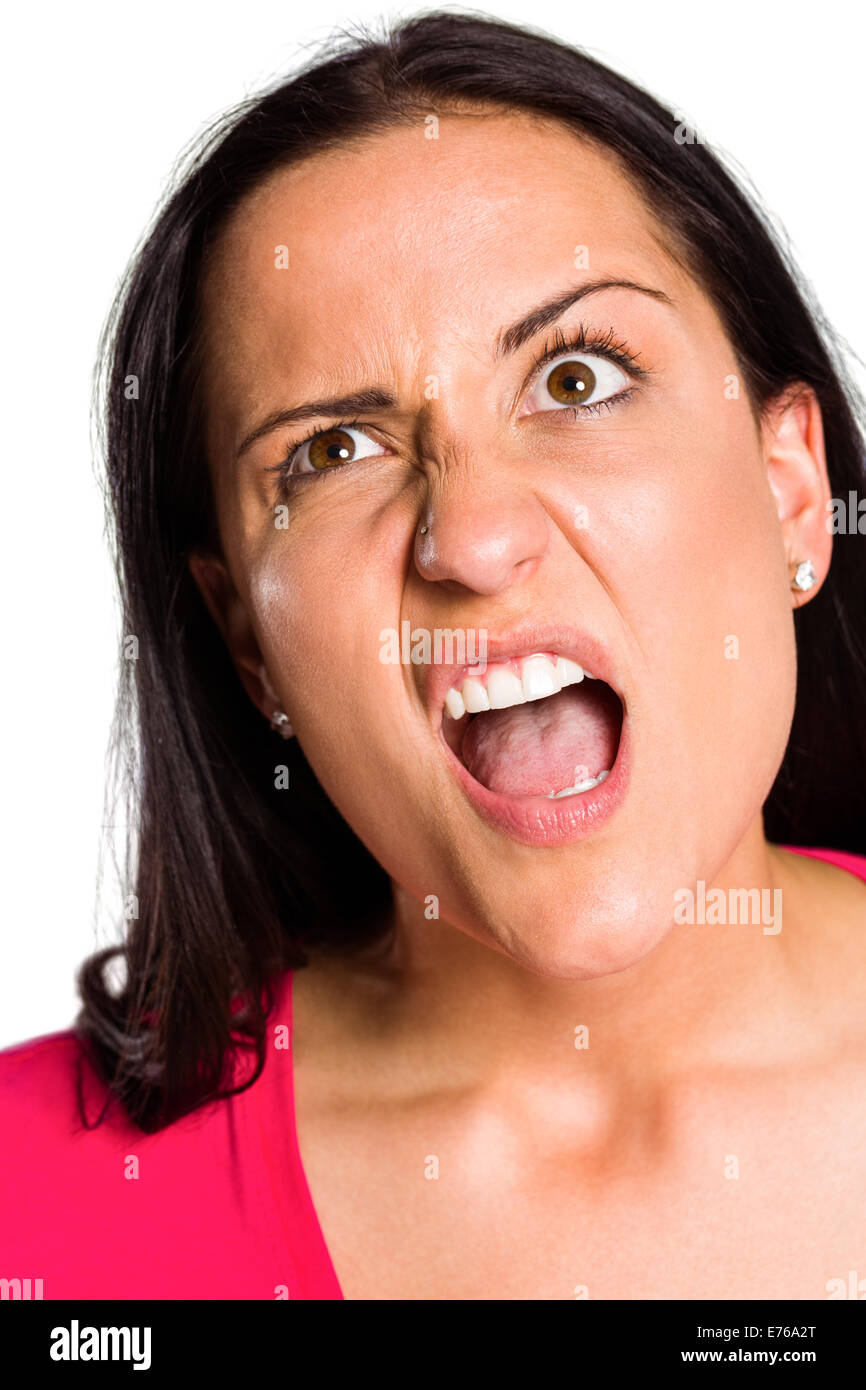 Confused brunette model posing wrinkling her face Stock Photo - Alamy
