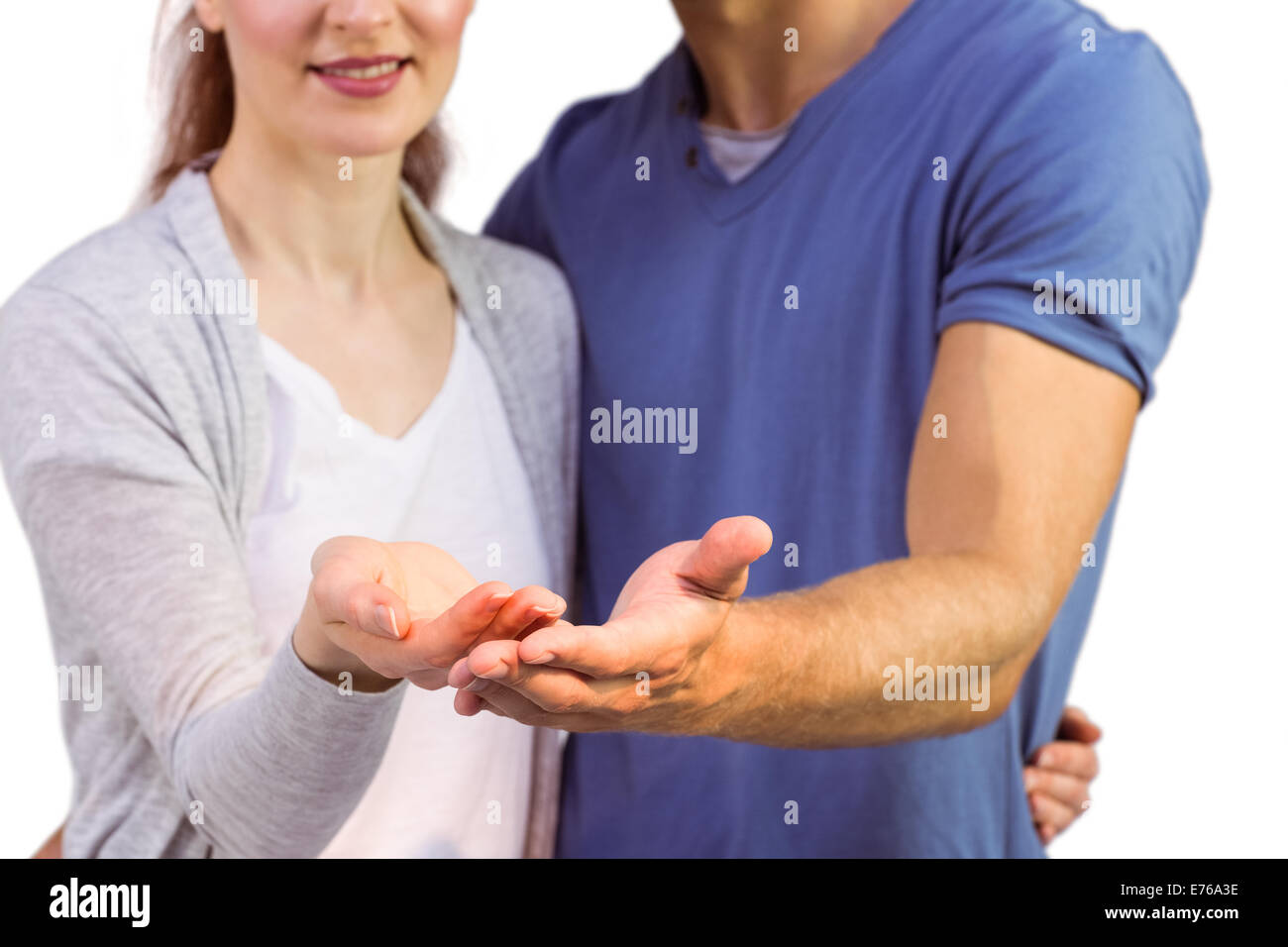 Couple holding out their hands Stock Photo - Alamy