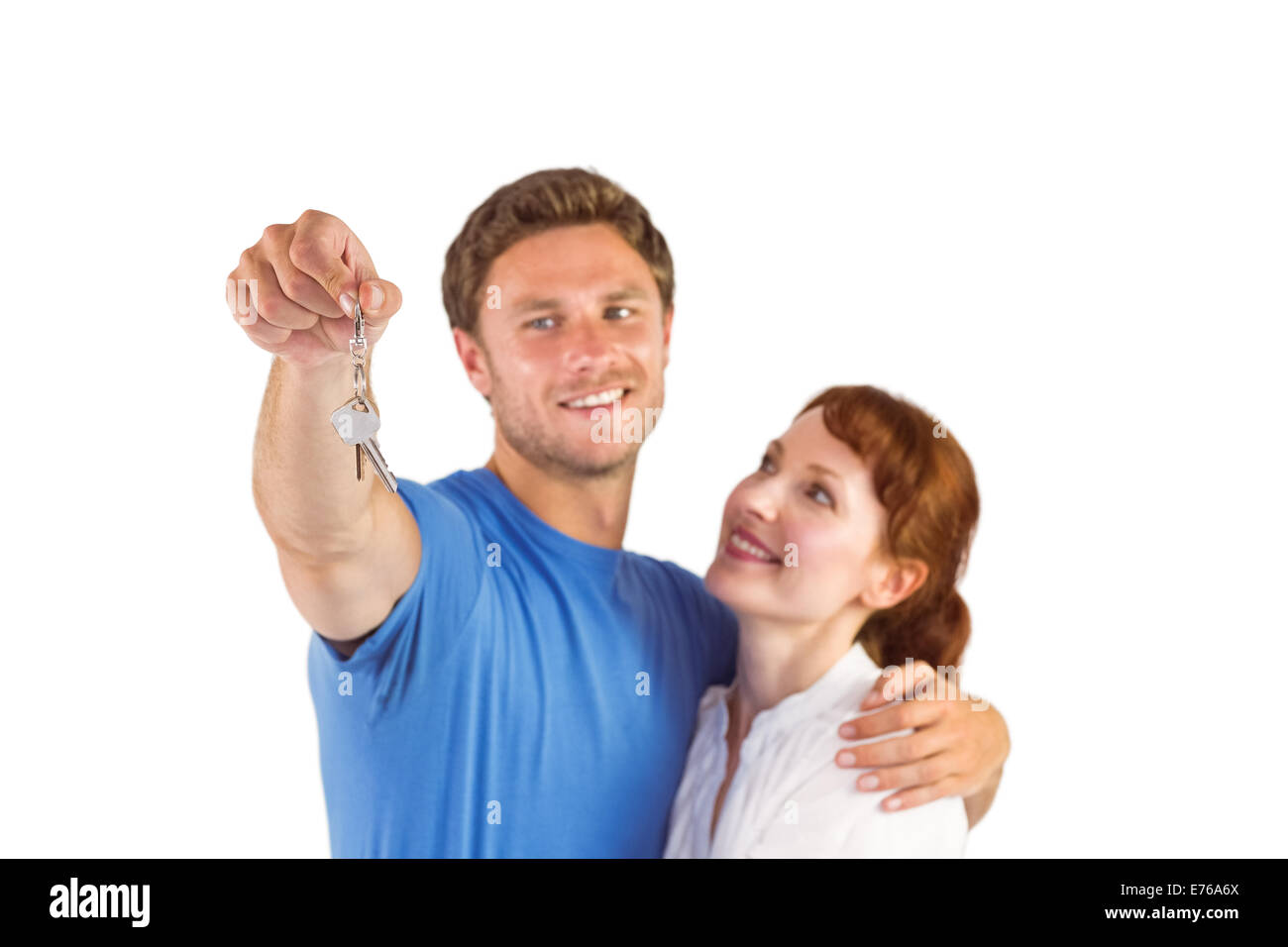 Couple holding keys to home Stock Photo - Alamy