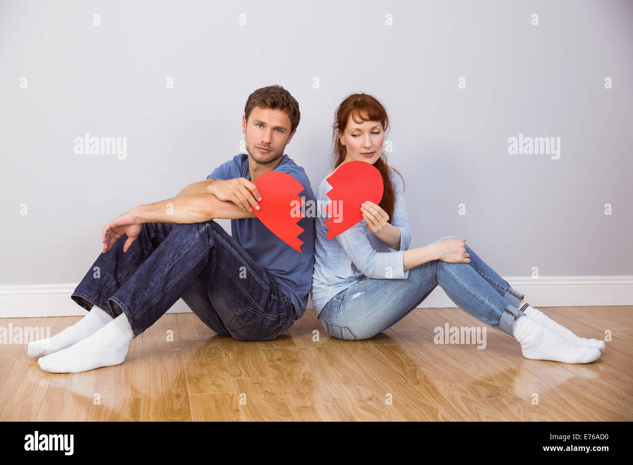 Couple holding a broken heart Stock Photo - Alamy