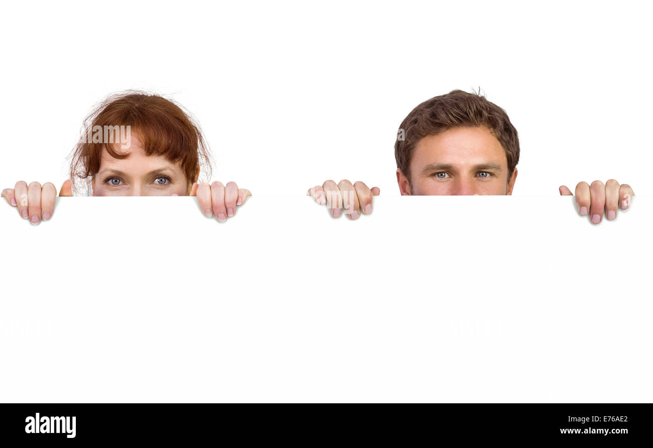 Couple looking at the camera Stock Photo - Alamy